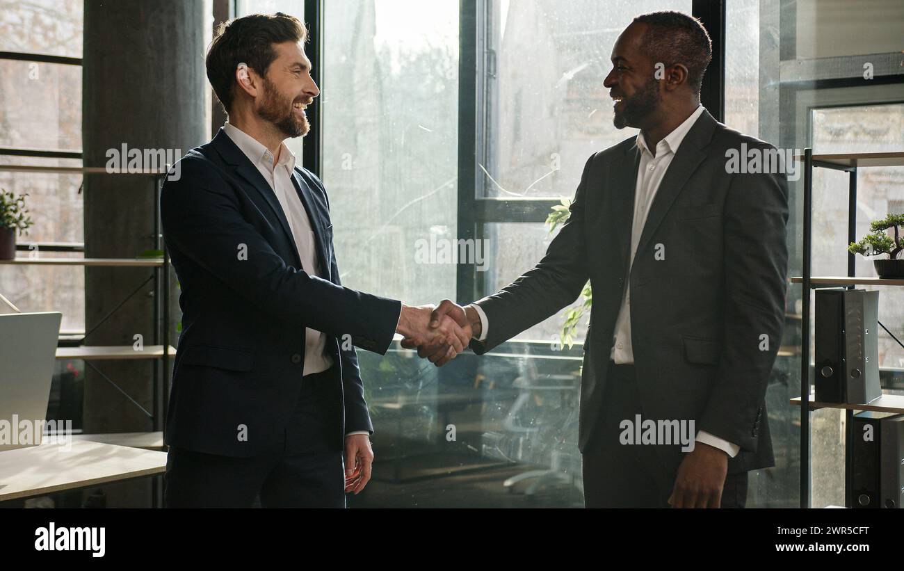 Diverse colleagues talking greeting hi-res stock photography and images ...