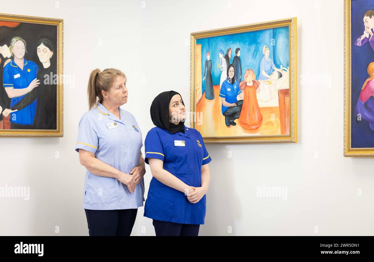 EDITORIAL USE ONLY Healthcare assistant Wendy Phillips (left) and nurse ...
