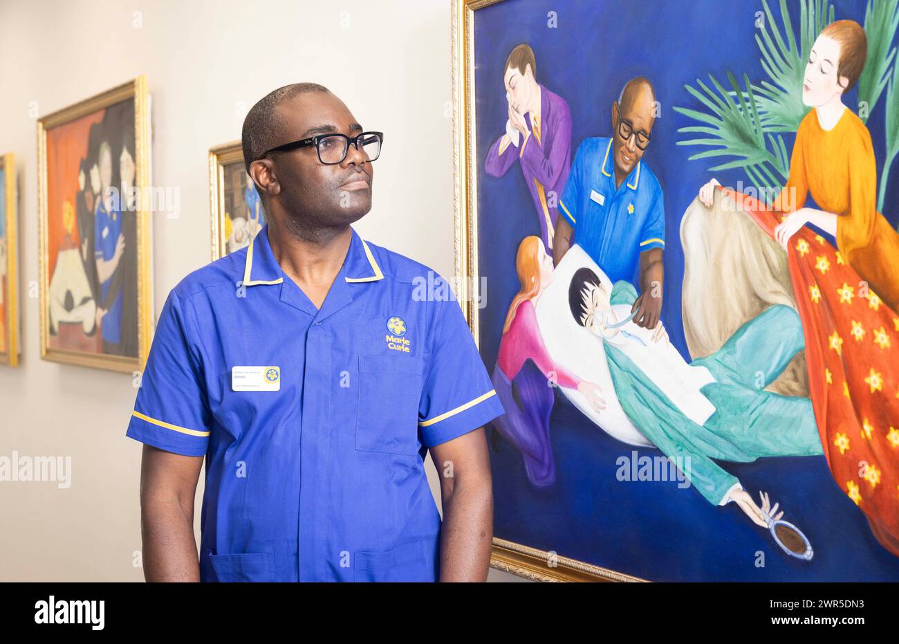 EDITORIAL USE ONLY Senior nurse, Isaac Otengo looks at a reimagined ...