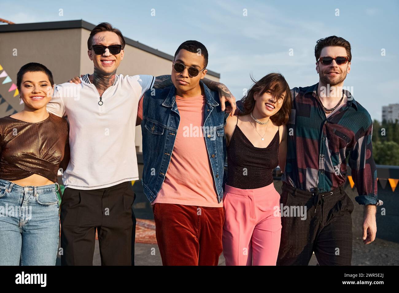 happy multicultural friends in vibrant outfits with sunglasses having ...