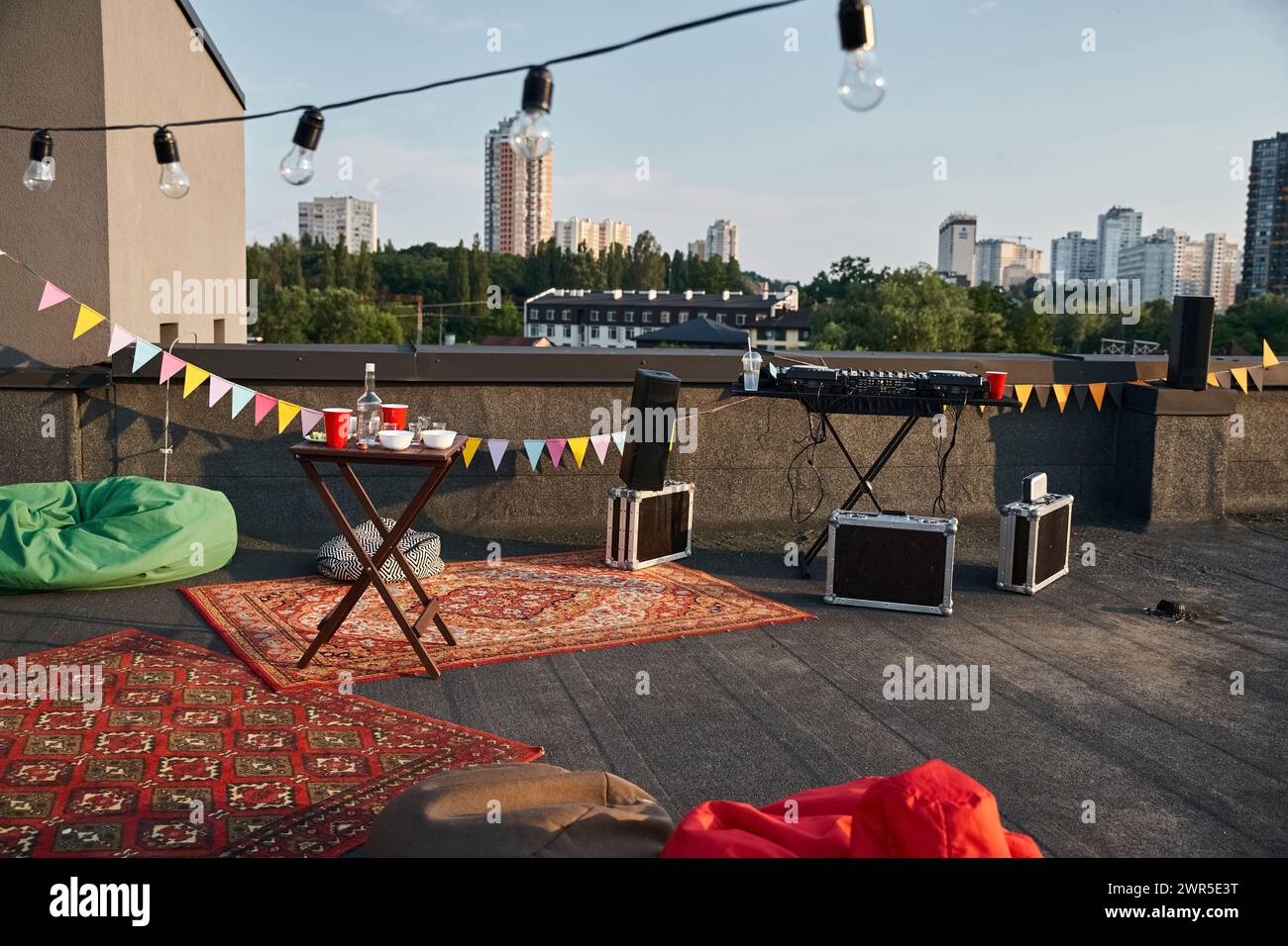 object photo of outdoor terrace rooftop with vibrant carpets and DJ ...