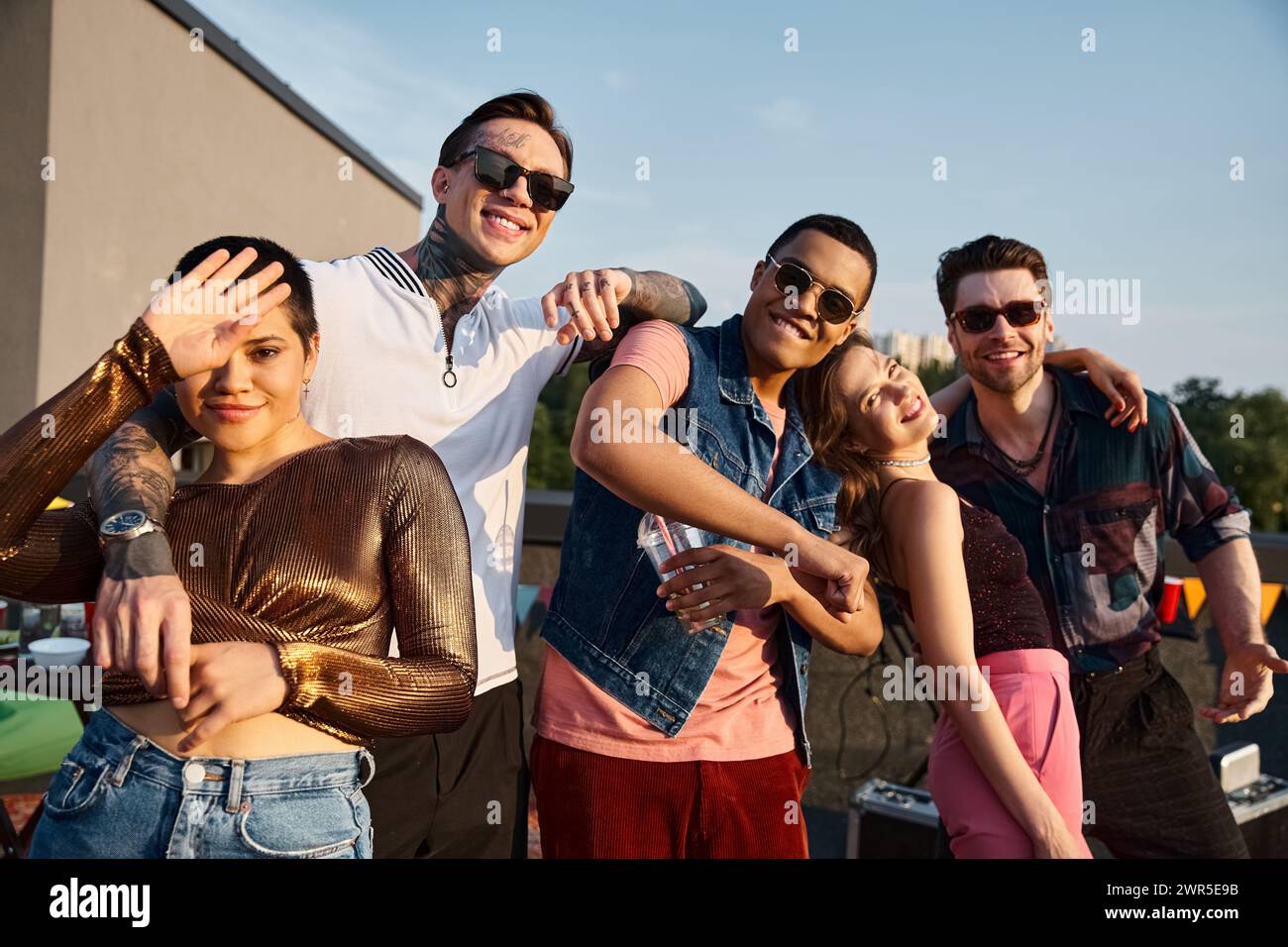 happy good looking diverse friends in stylish urban attires smiling at ...