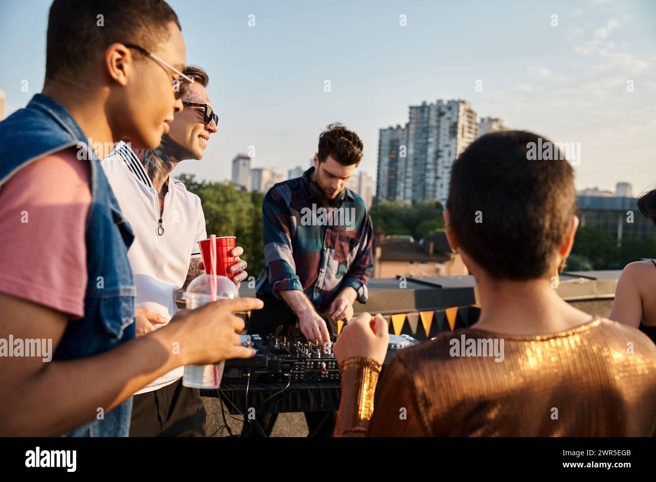 appealing diverse jolly friends drinking and having fun at rooftop ...