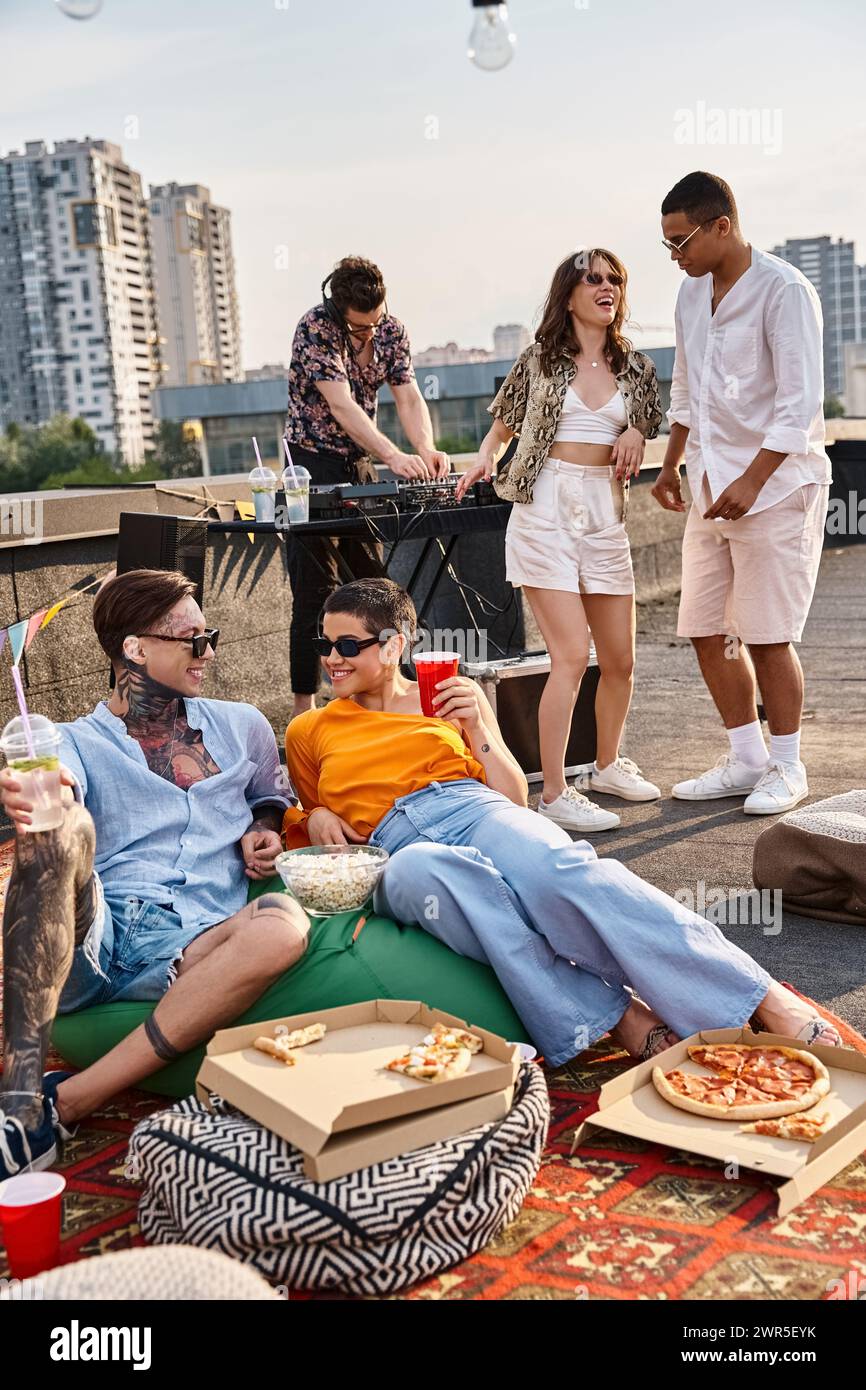 multicultural cheerful people in urban vibrant attires enjoying rooftop ...