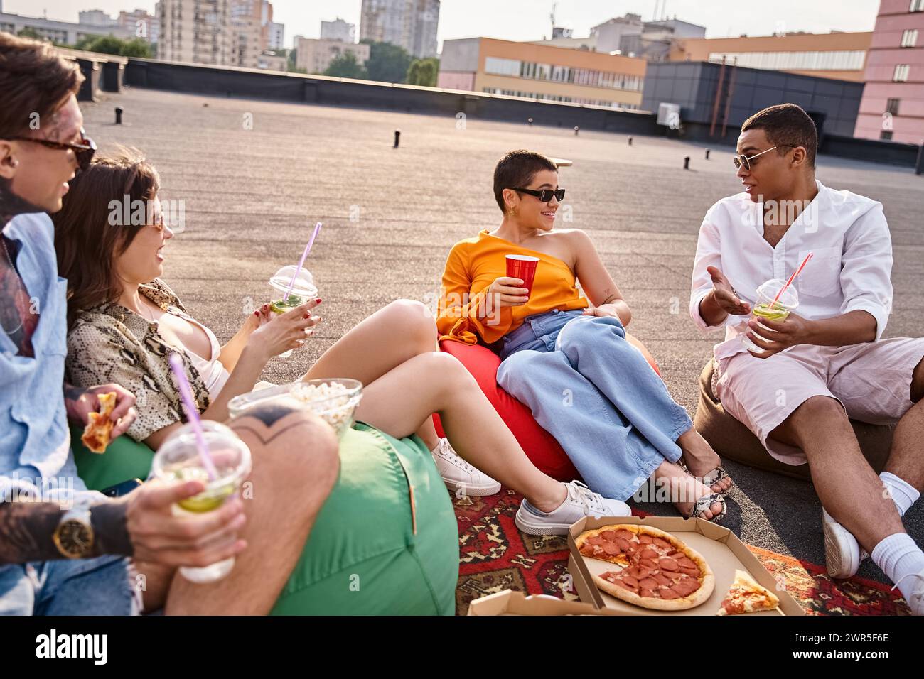 Men women sitting on roof hi-res stock photography and images - Alamy