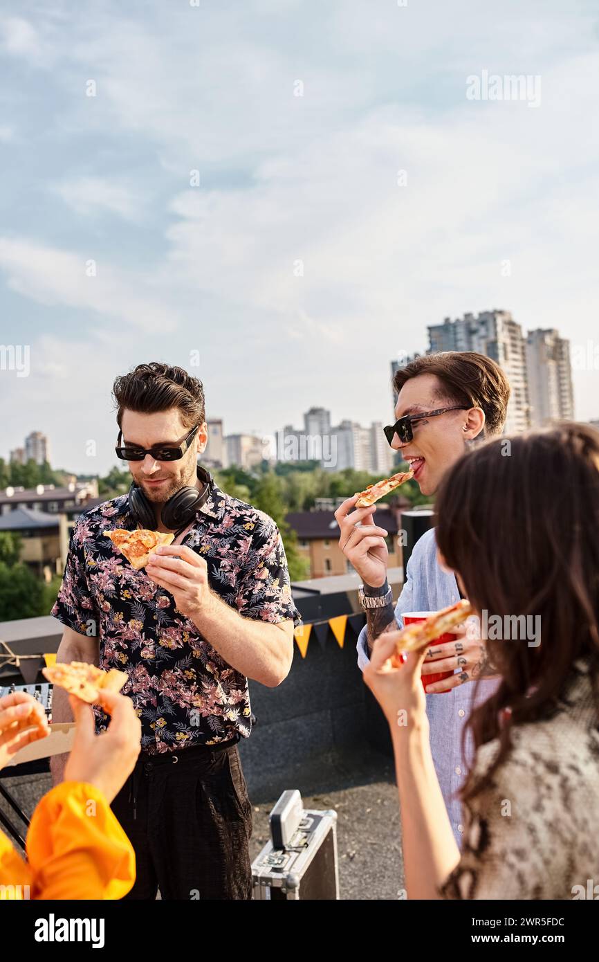 joyous good looking friends in casual vivid attires eating pizza and ...