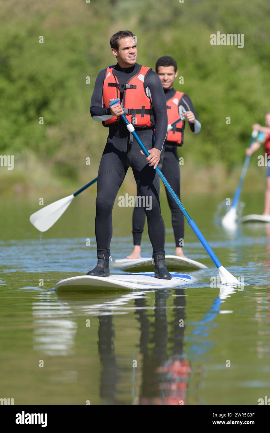 people during stand up paddleboard Stock Photo - Alamy