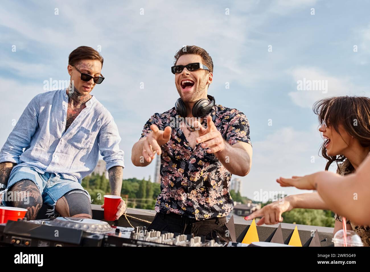 cheerful good looking people in casual attires with sunglasses partying ...