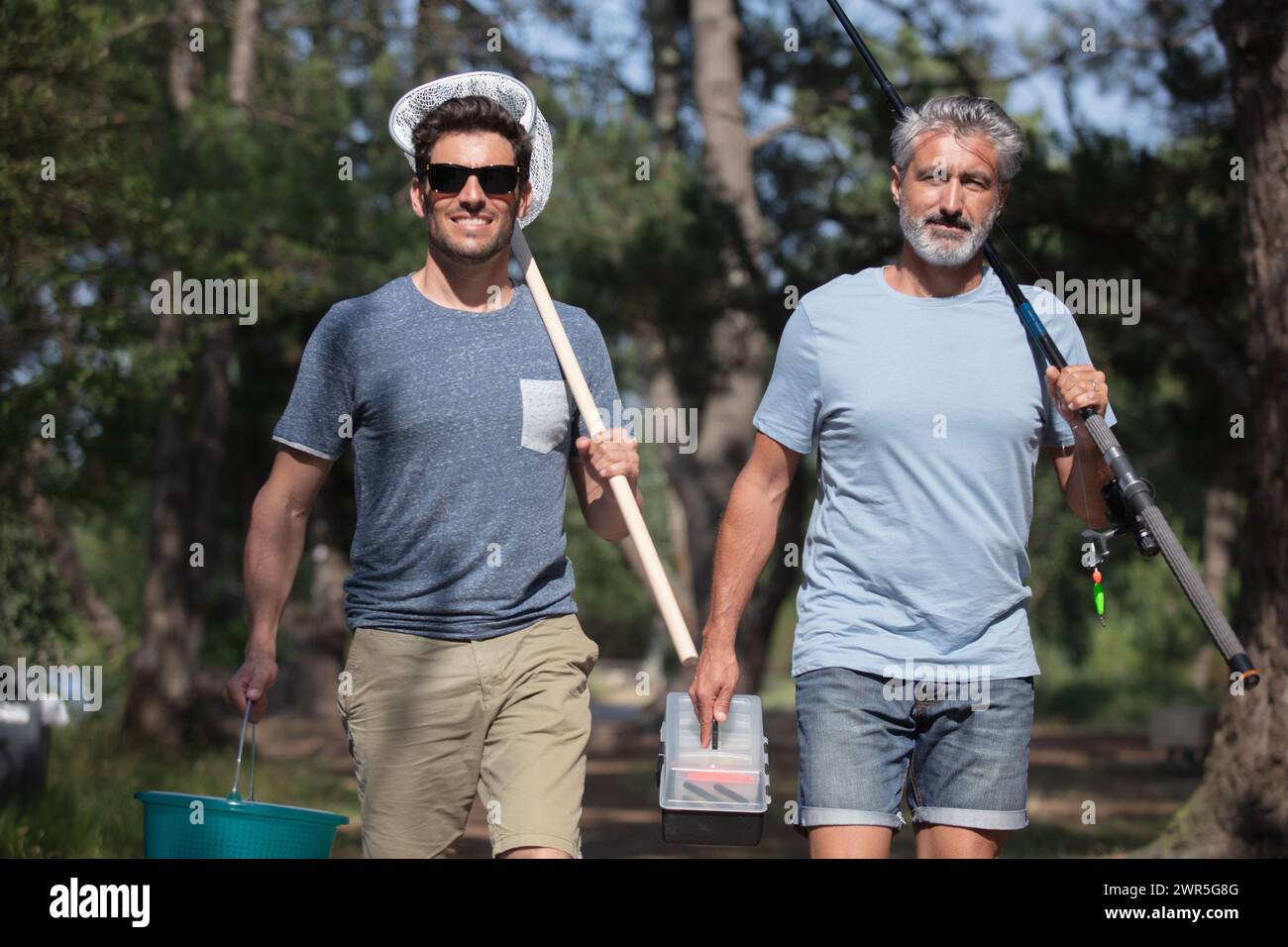 Two fishermen walking hi-res stock photography and images - Alamy