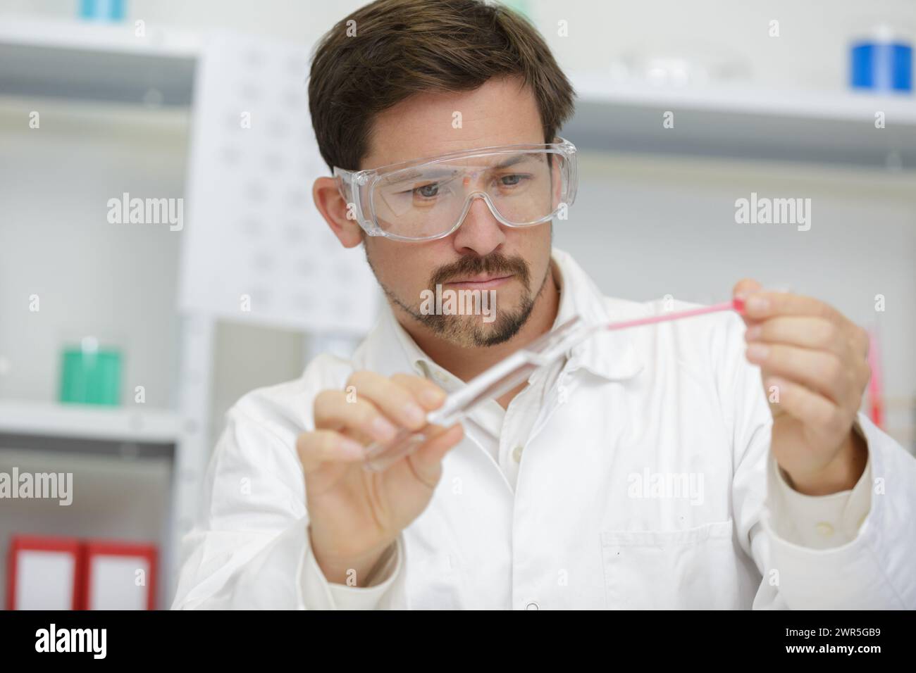 researcher at work in a laboratory with a blood pipette Stock Photo - Alamy