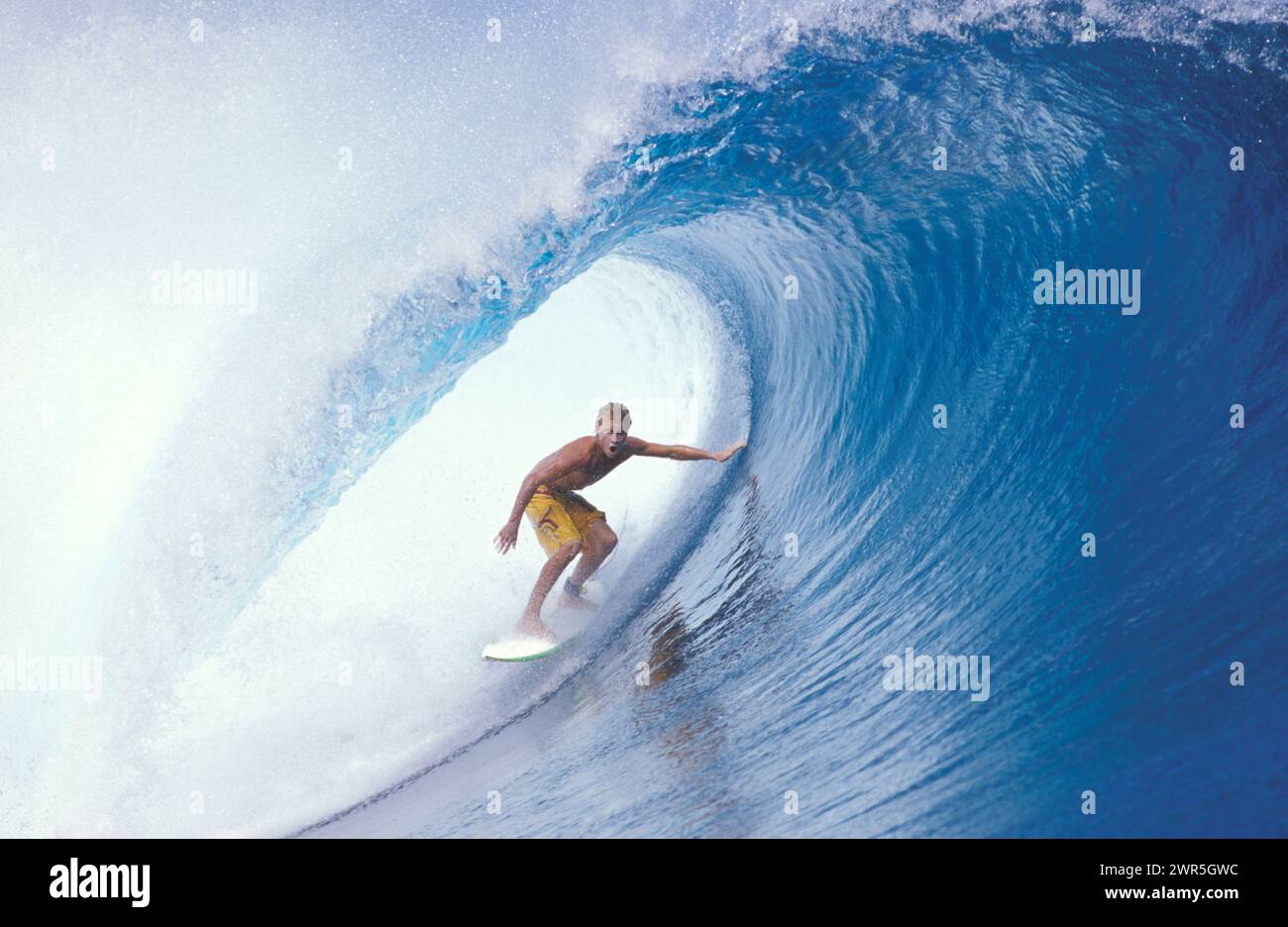 Surfing in the tube at Teahupoo on the island of Tahiti Stock Photo - Alamy