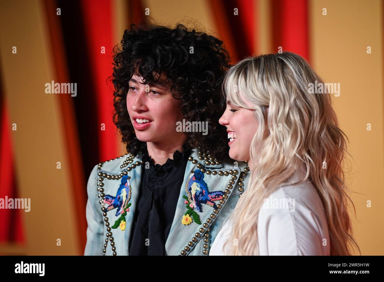 USA. 10th Mar, 2024. Towa Bird and Renee Rapp walking on the red carpet ...