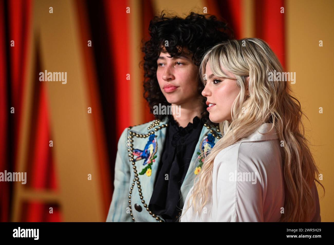 USA. 10th Mar, 2024. Towa Bird and Renee Rapp walking on the red carpet ...