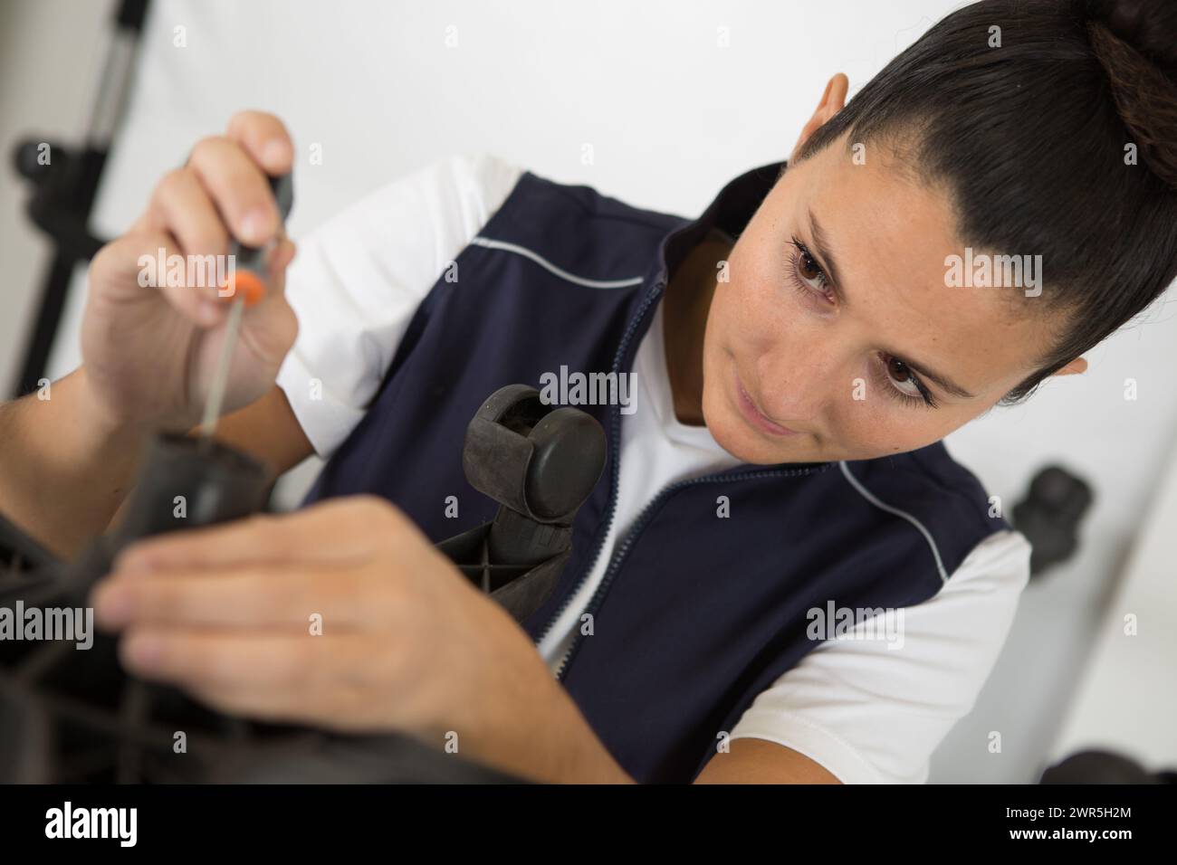Woman screwdriver assembling chair hi-res stock photography and images ...
