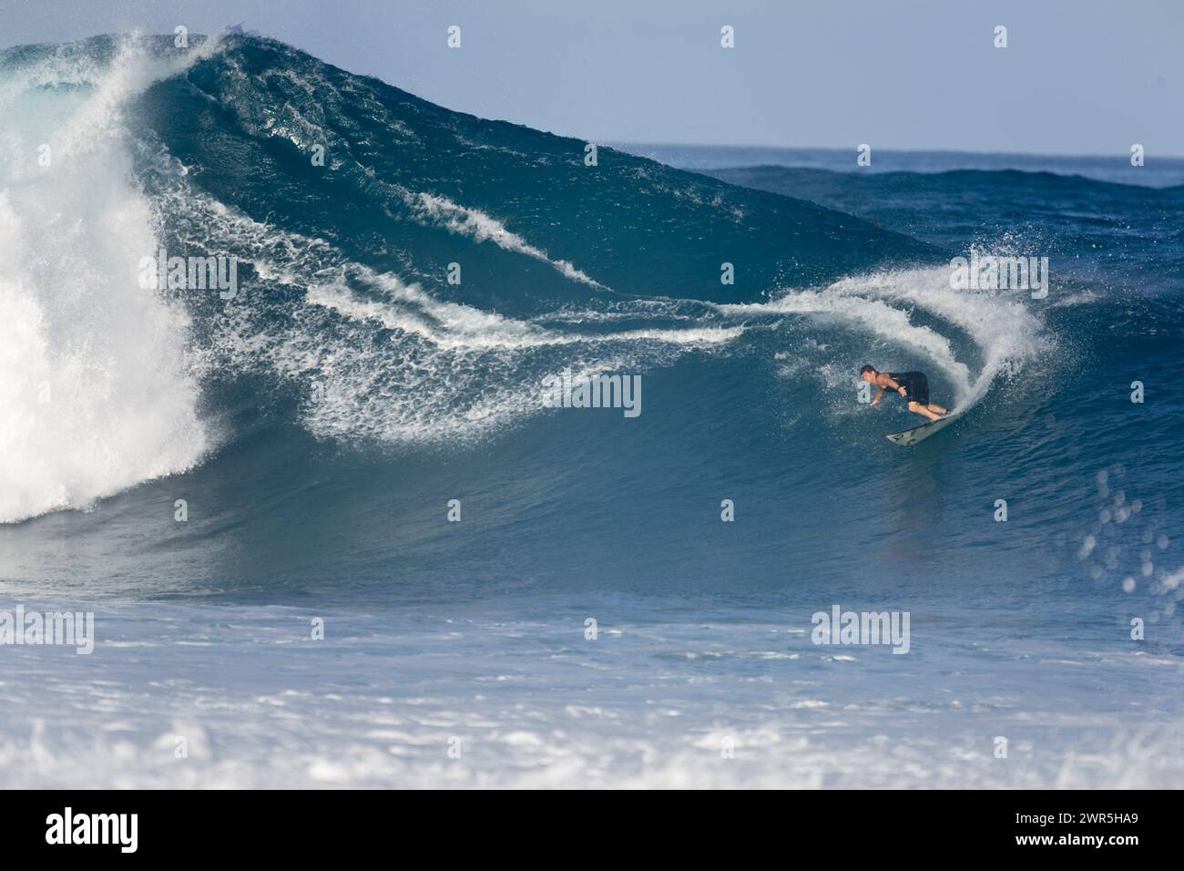 David Wassel surfing big wave at Pipeline, on the north shore of Oahu ...