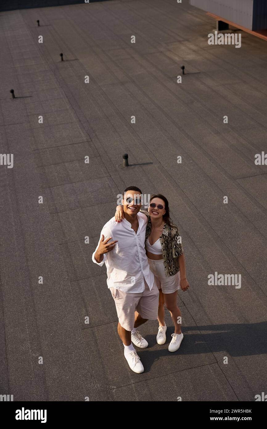 Appealing Diverse Man And Woman With Sunglasses In Vibrant Casual