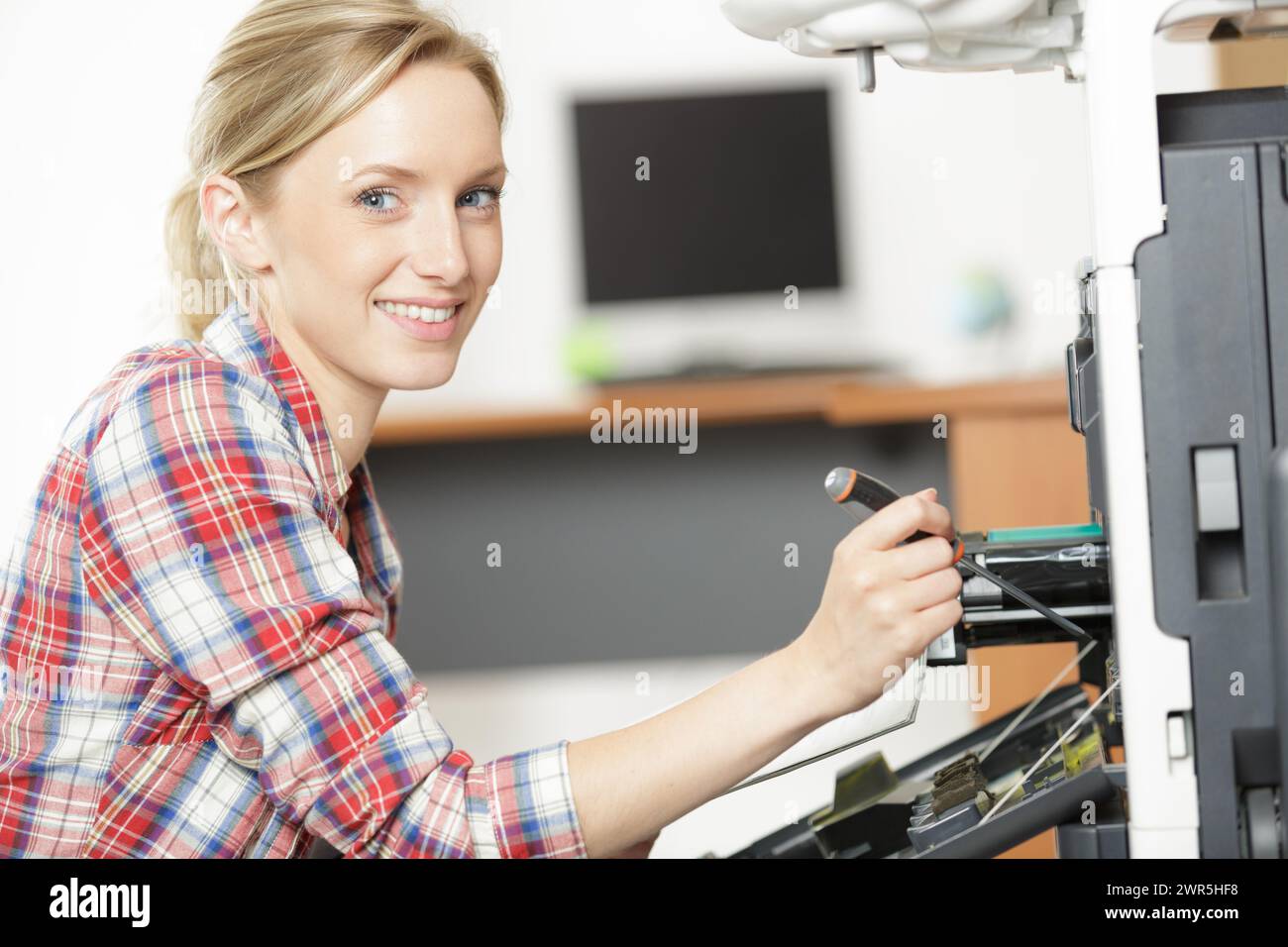 Beautiful woman checking printer hi-res stock photography and images ...