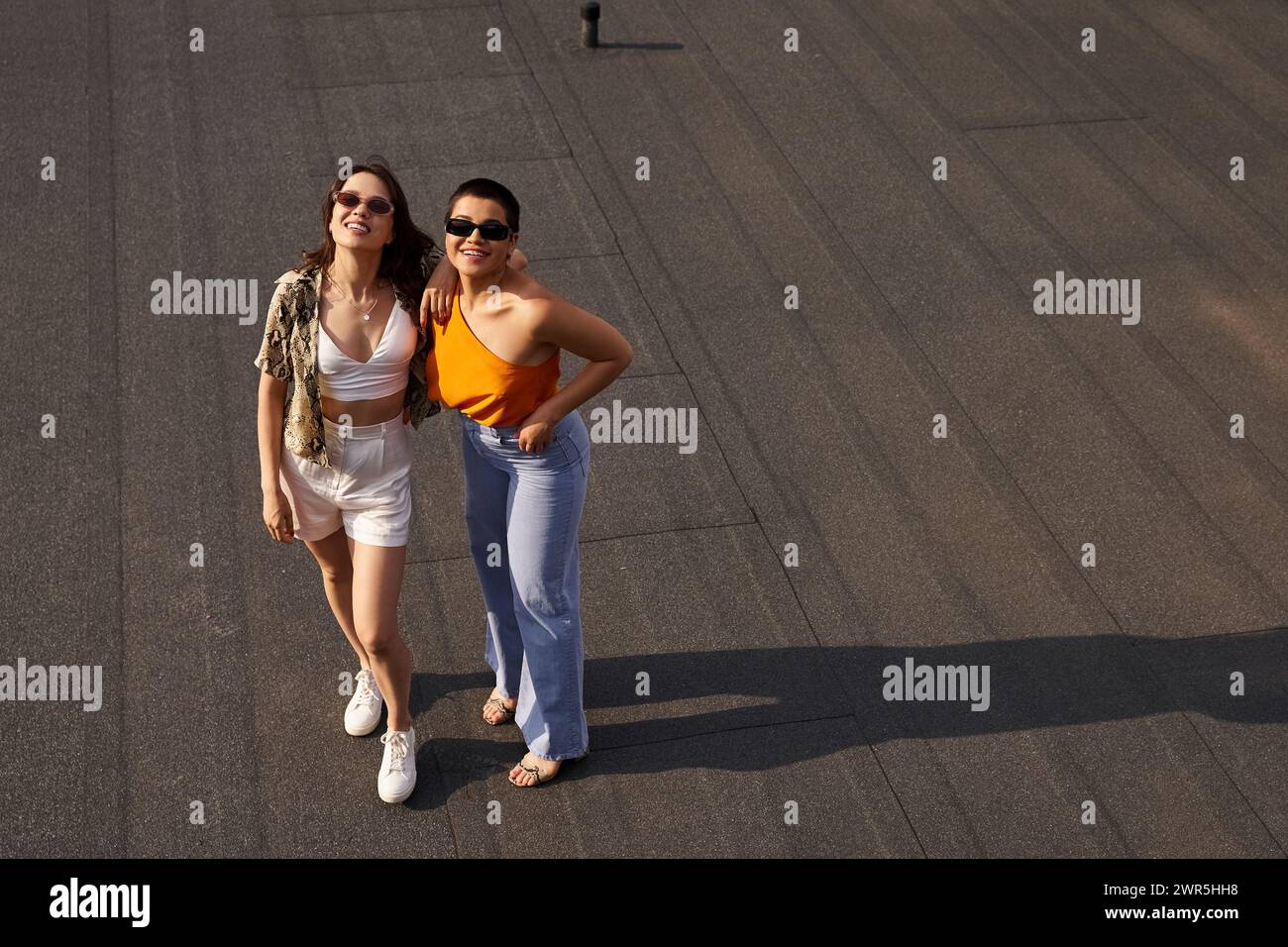Cheerful Appealing Women In Vibrant Casual Attires Posing Together On