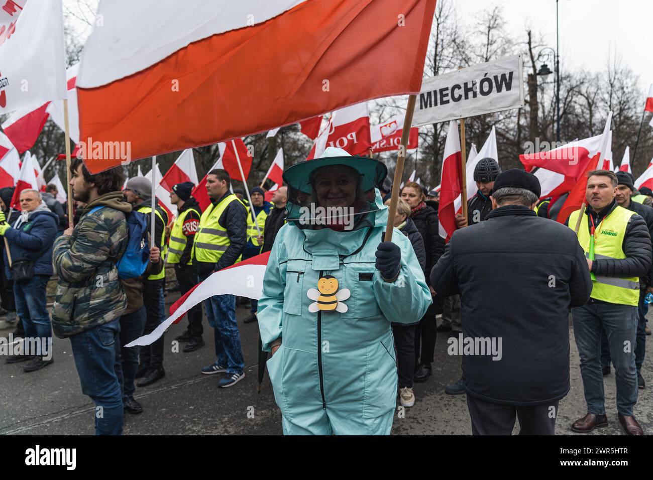 06.03.2024. Warsaw, Poland. a beekeeper woman with uniform holding a ...