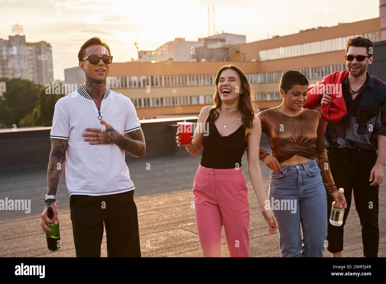 drunk jolly friends in casual vivid attires holding alcohol drinks and ...
