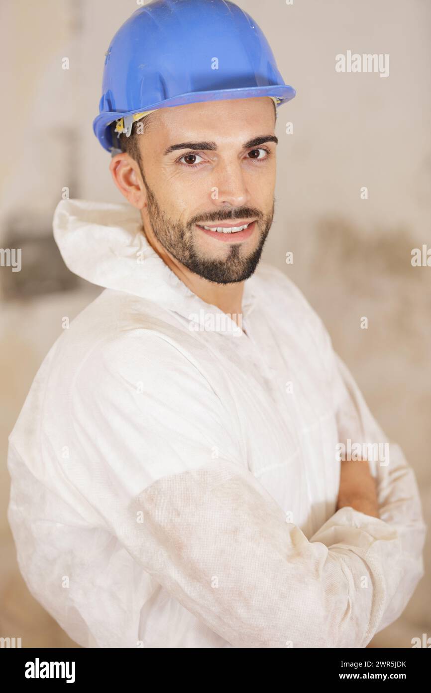 young engineer worker wears yellow helmet with arm crossed Stock Photo ...