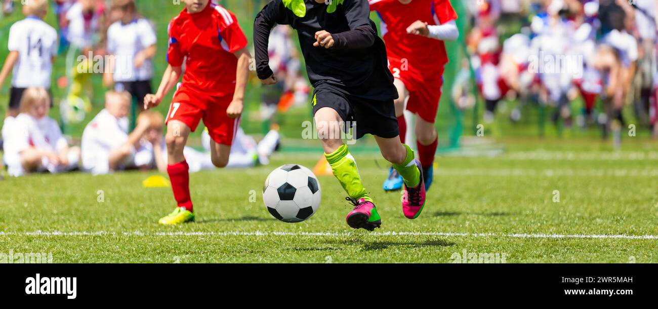 Group of Children Playing Soccer Football League Game. A Player Running ...