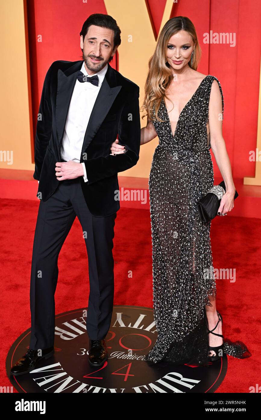 Los Angeles, USA. March 10th, 2024. Adrian Brodie and Georgina Chapman ...