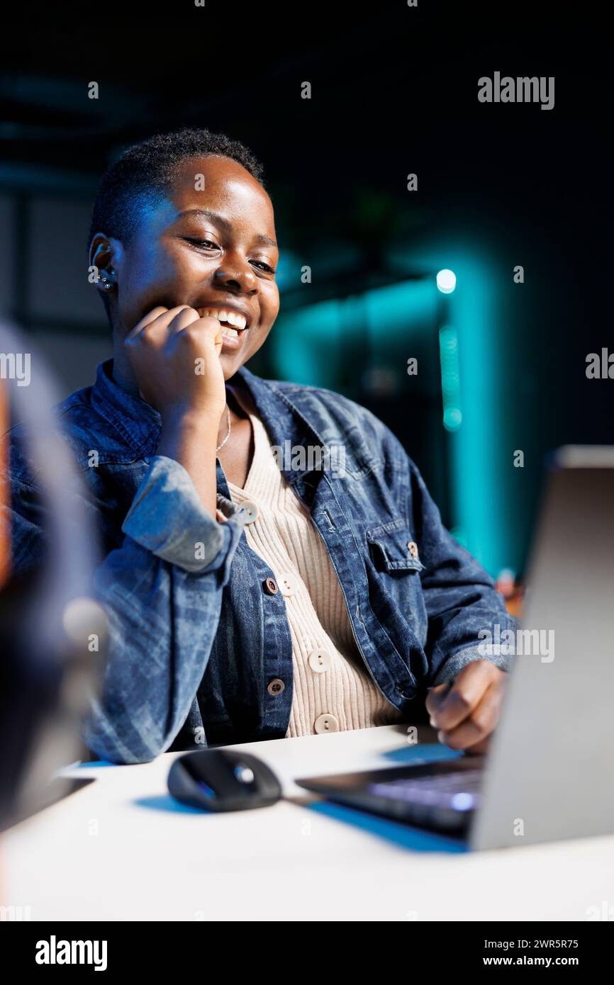 Close Up Of Black Woman Laughing While Using A Digital Laptop At The
