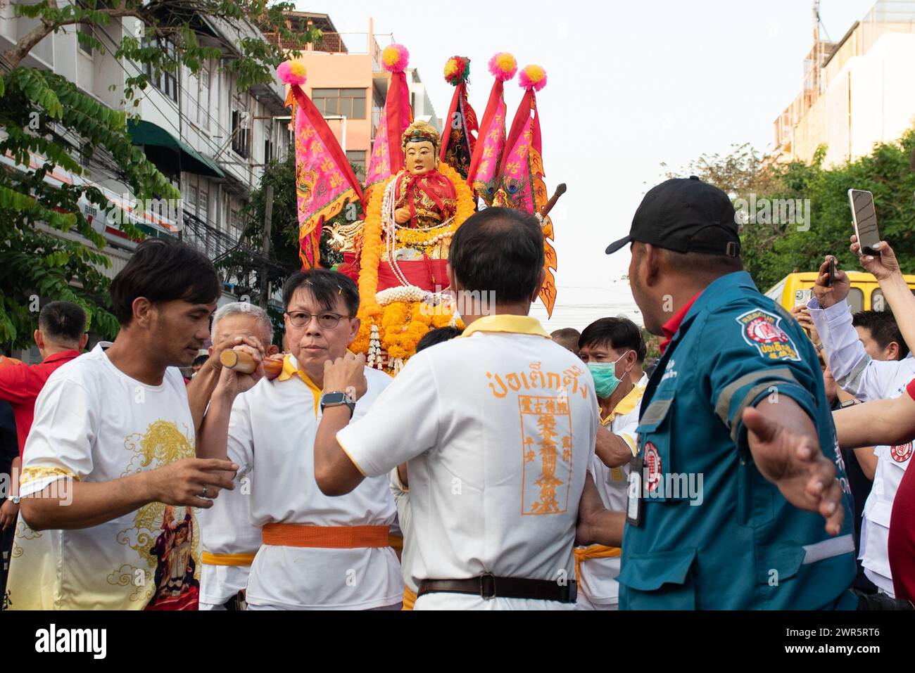 Believers parade a statue replica of Chao Mae Lim Ko Niao god, a deity ...