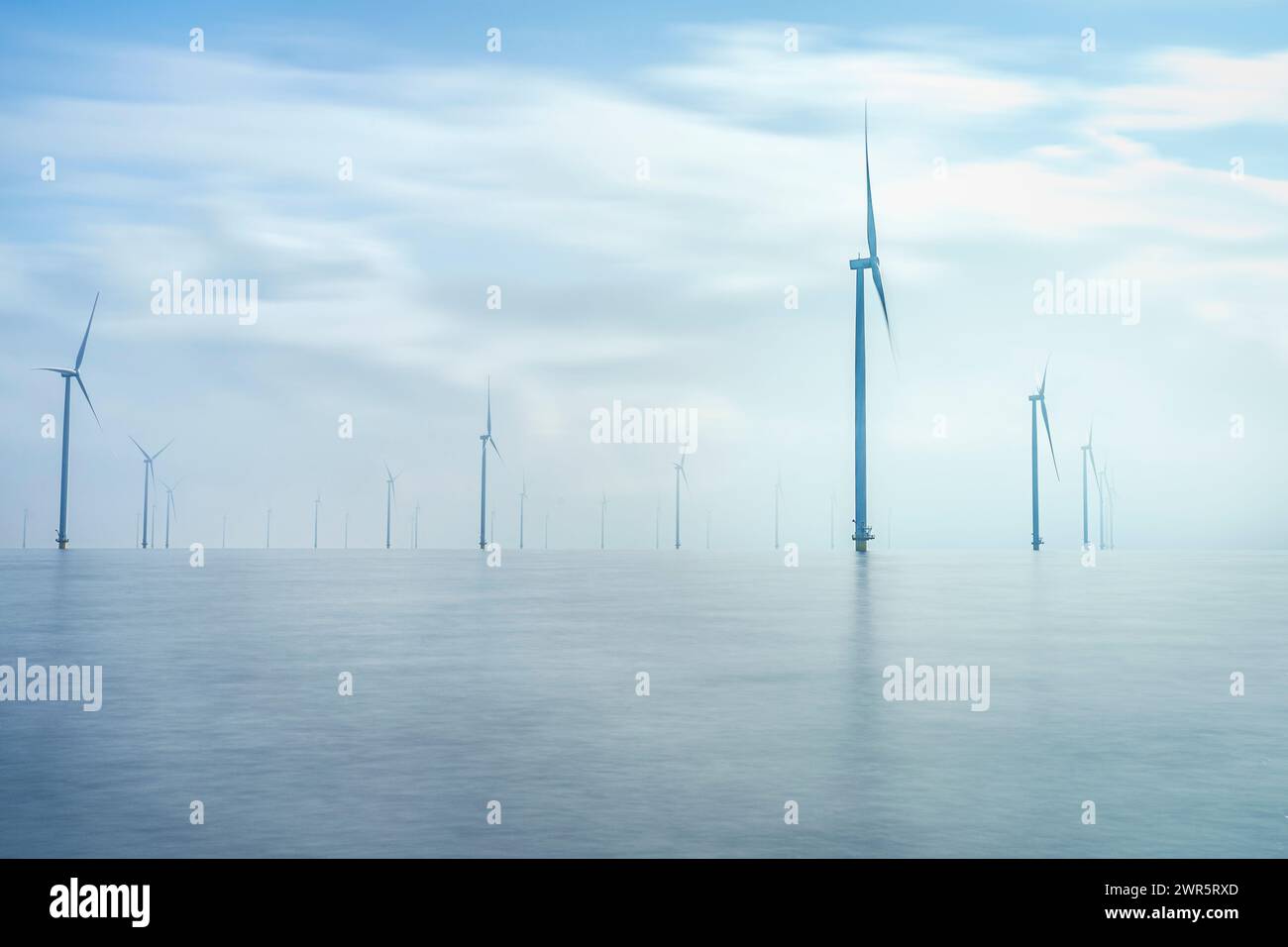 Windmill park in the ocean, aerial view of windmill turbines generating ...
