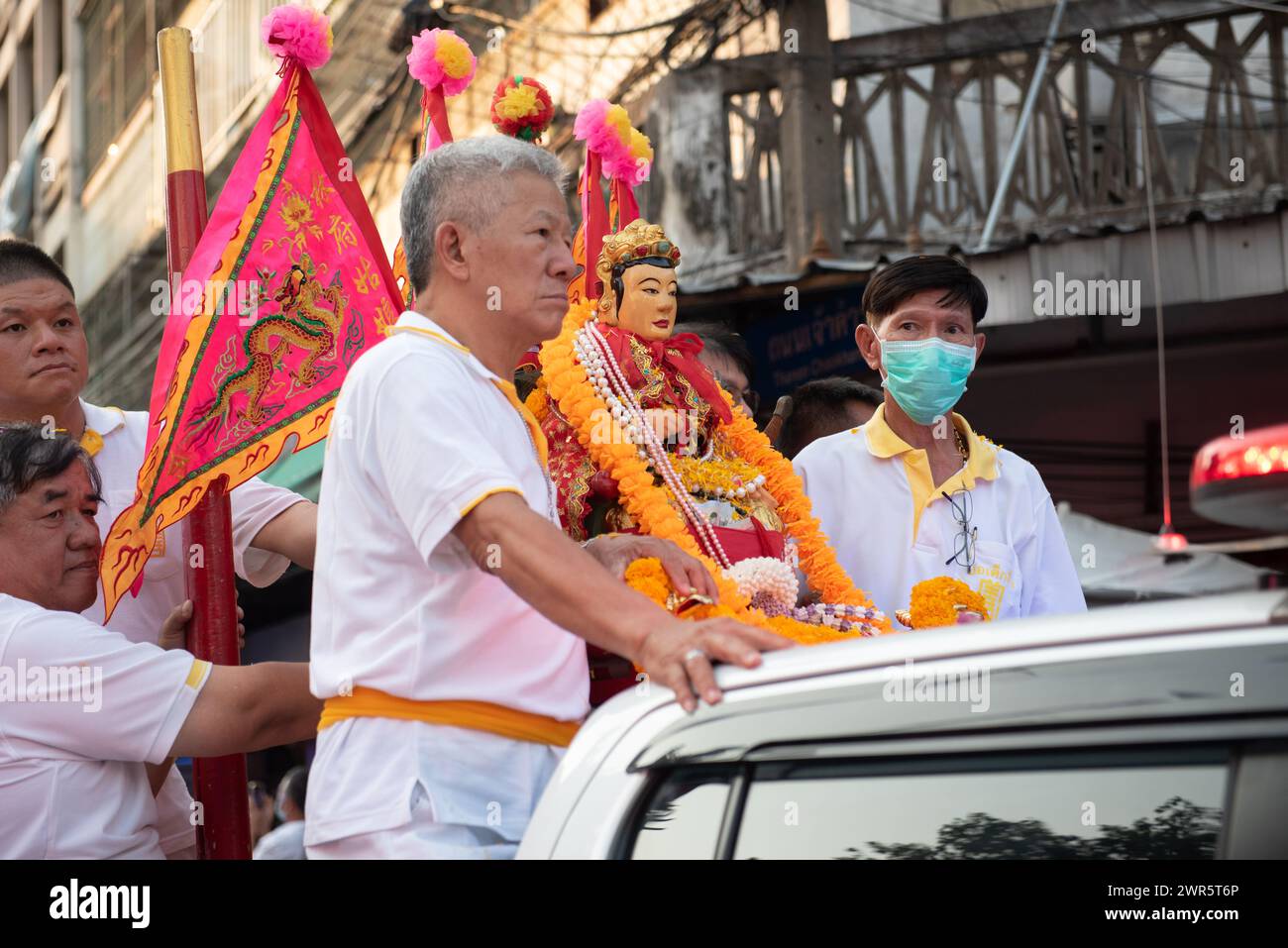 Bangkok, Thailand. 10th Mar, 2024. Believers parade a statue replica of ...