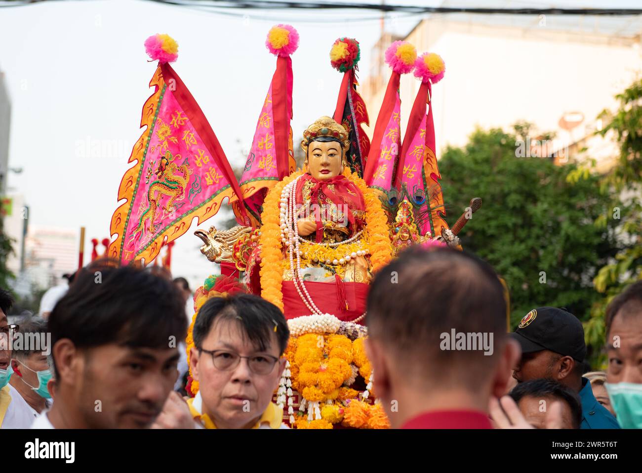 Bangkok, Thailand. 10th Mar, 2024. Believers parade a statue replica of ...