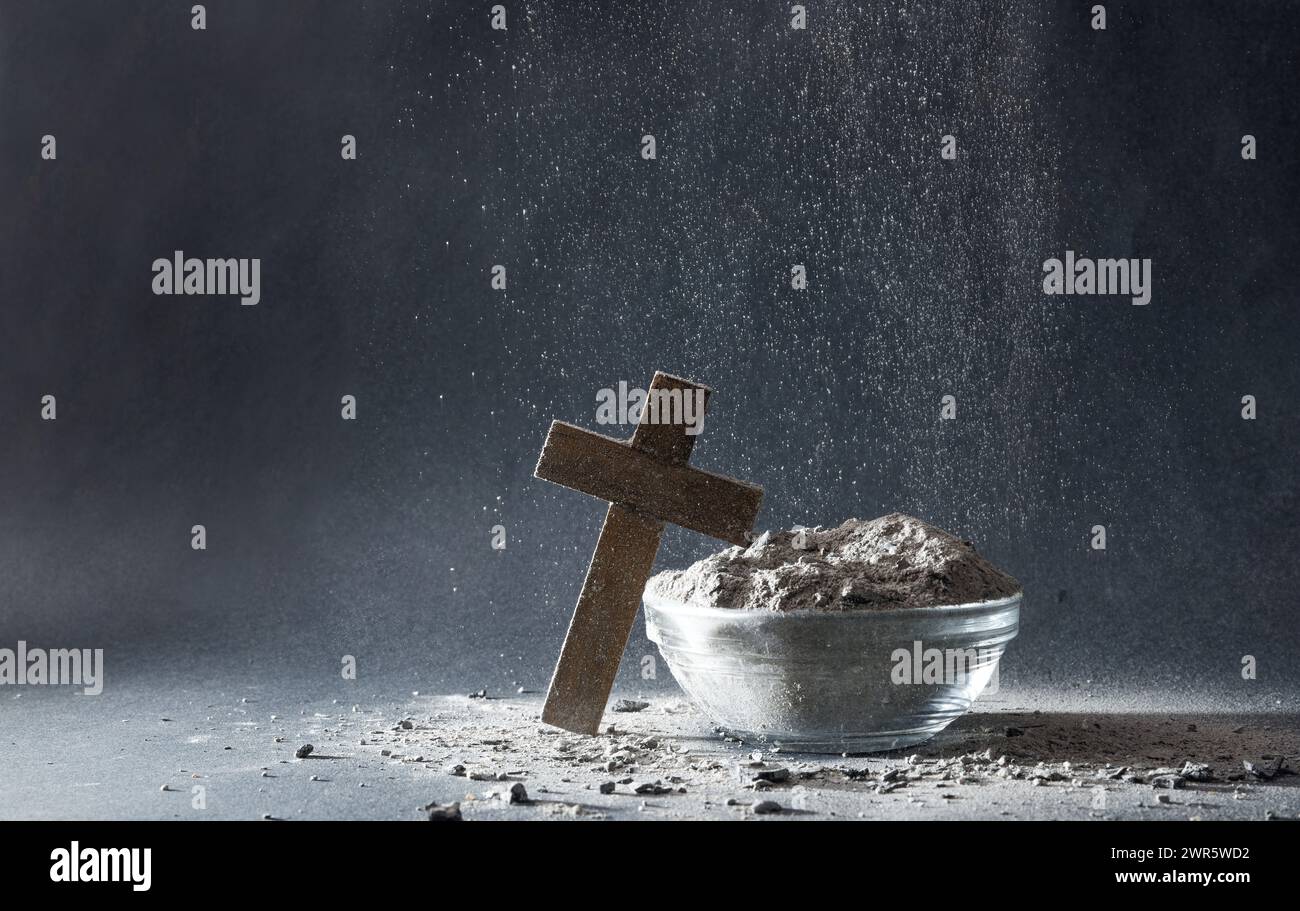 Ashes falling on Christian cross and container full of ashes isolated ...