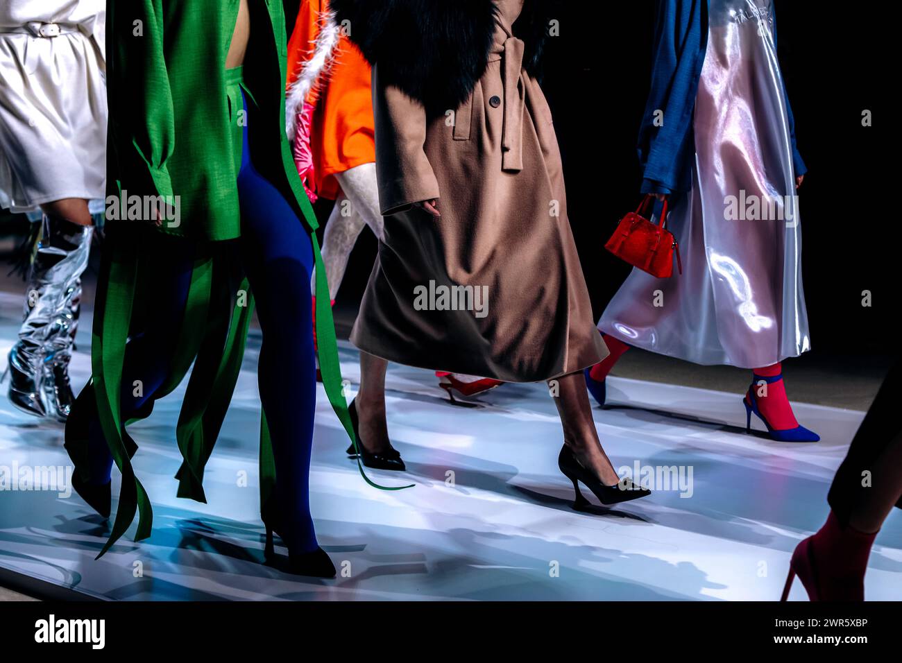 Models in trendy fashion outfits at the fashion show finale. Women's ...