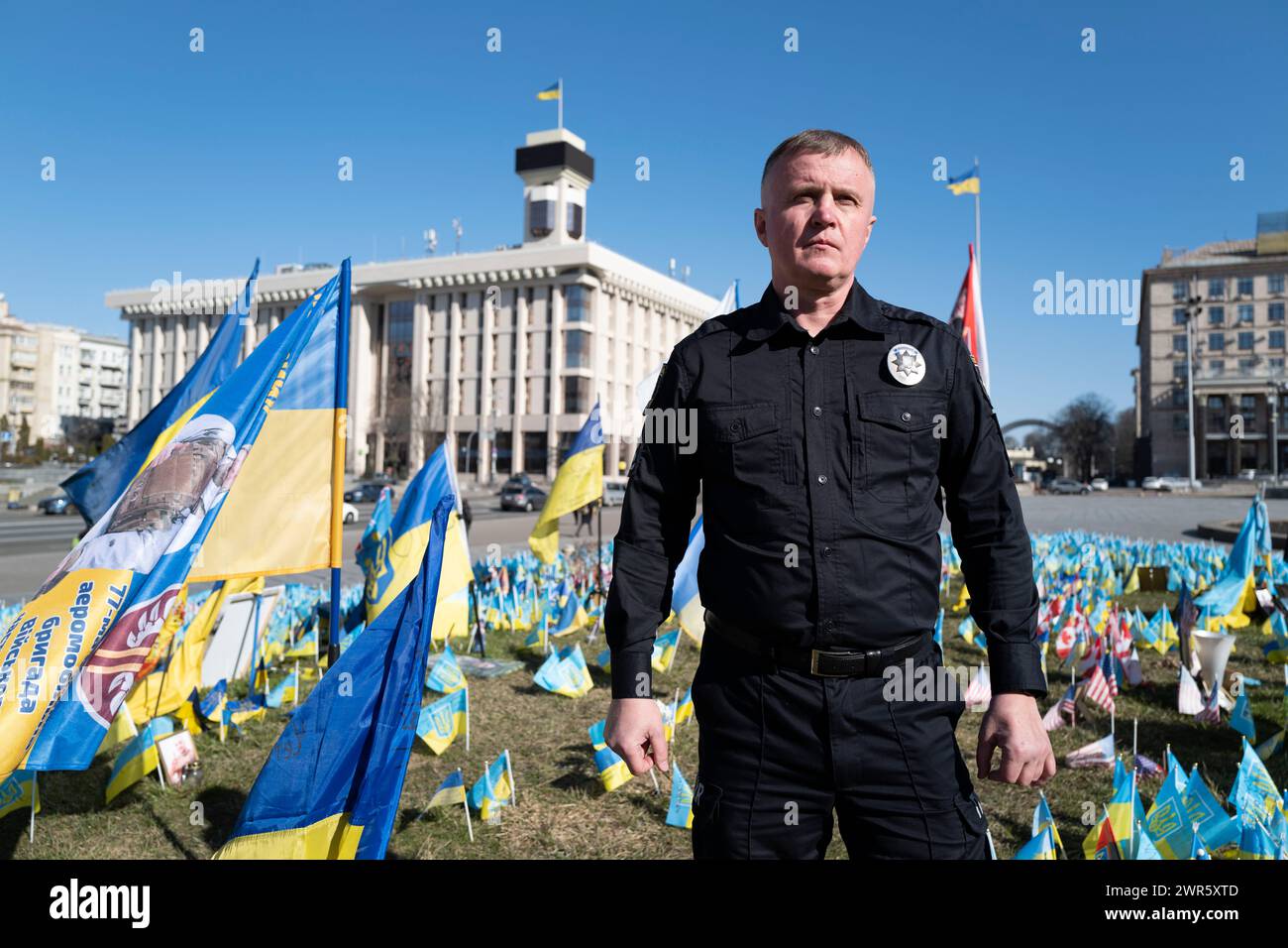 Ukrainian police officer Volodymyr Nikulin poses for a photo in downtown Kyiv, Monday March 11 ...