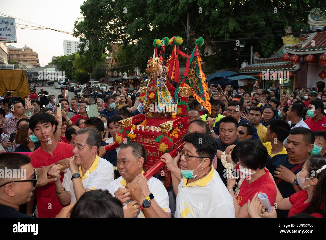 Bangkok, Thailand. 10th Mar, 2024. Believers parade a statue replica of ...