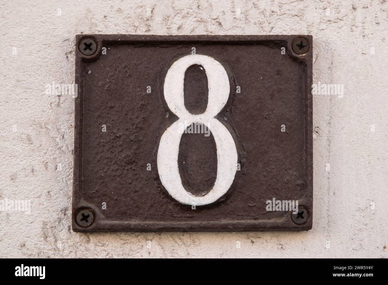 Old retro weathered cast iron plate with number 8 Stock Photo - Alamy