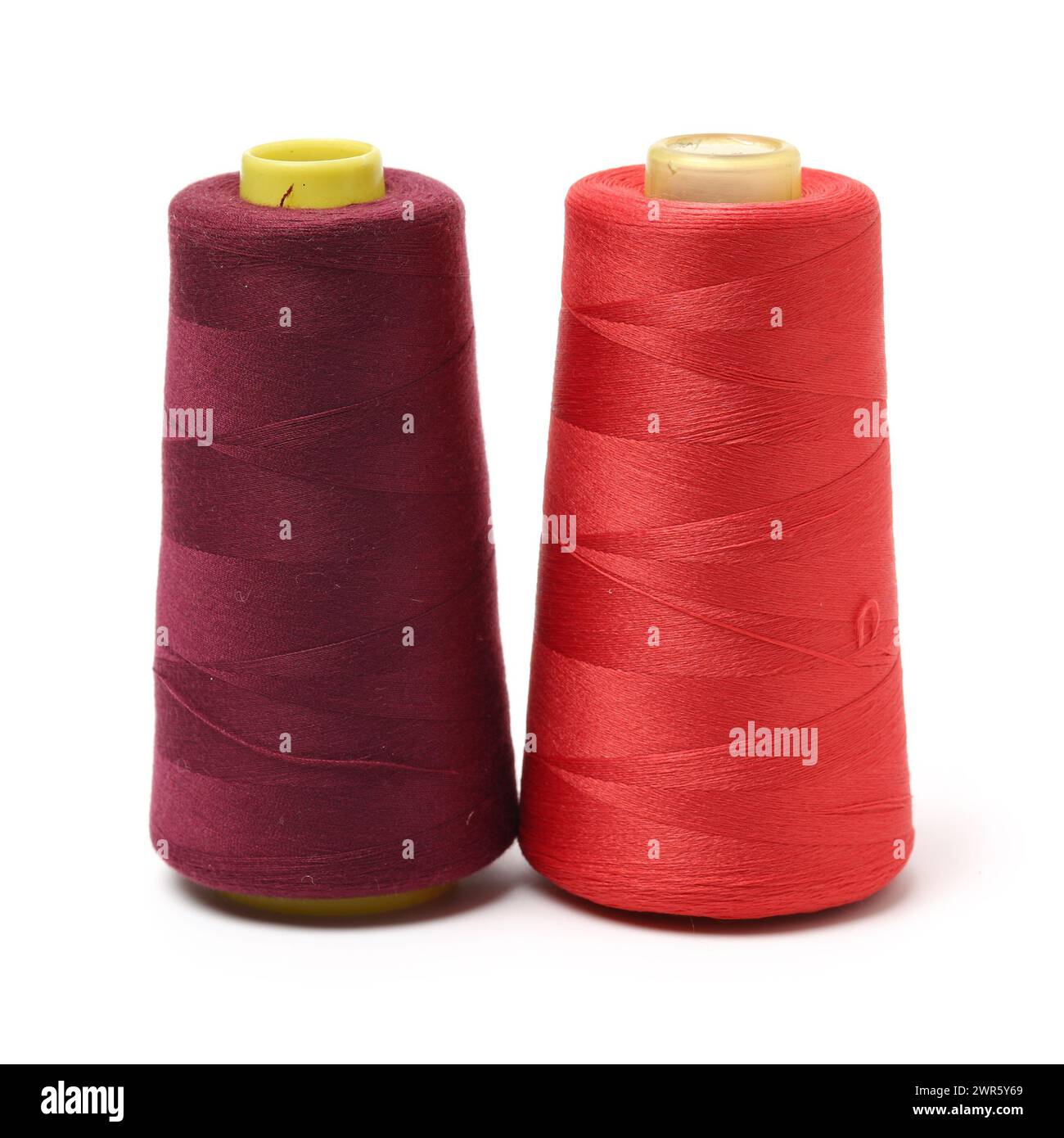 spools of thread for the textile industry on white background Stock ...