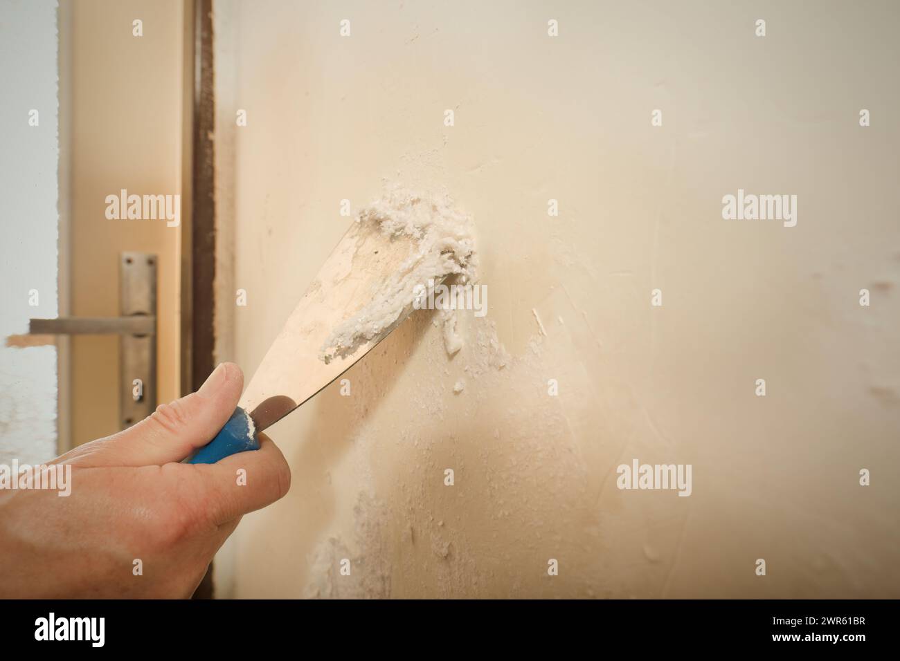 Detail of removing old wallpapers in apartment room Stock Photo - Alamy