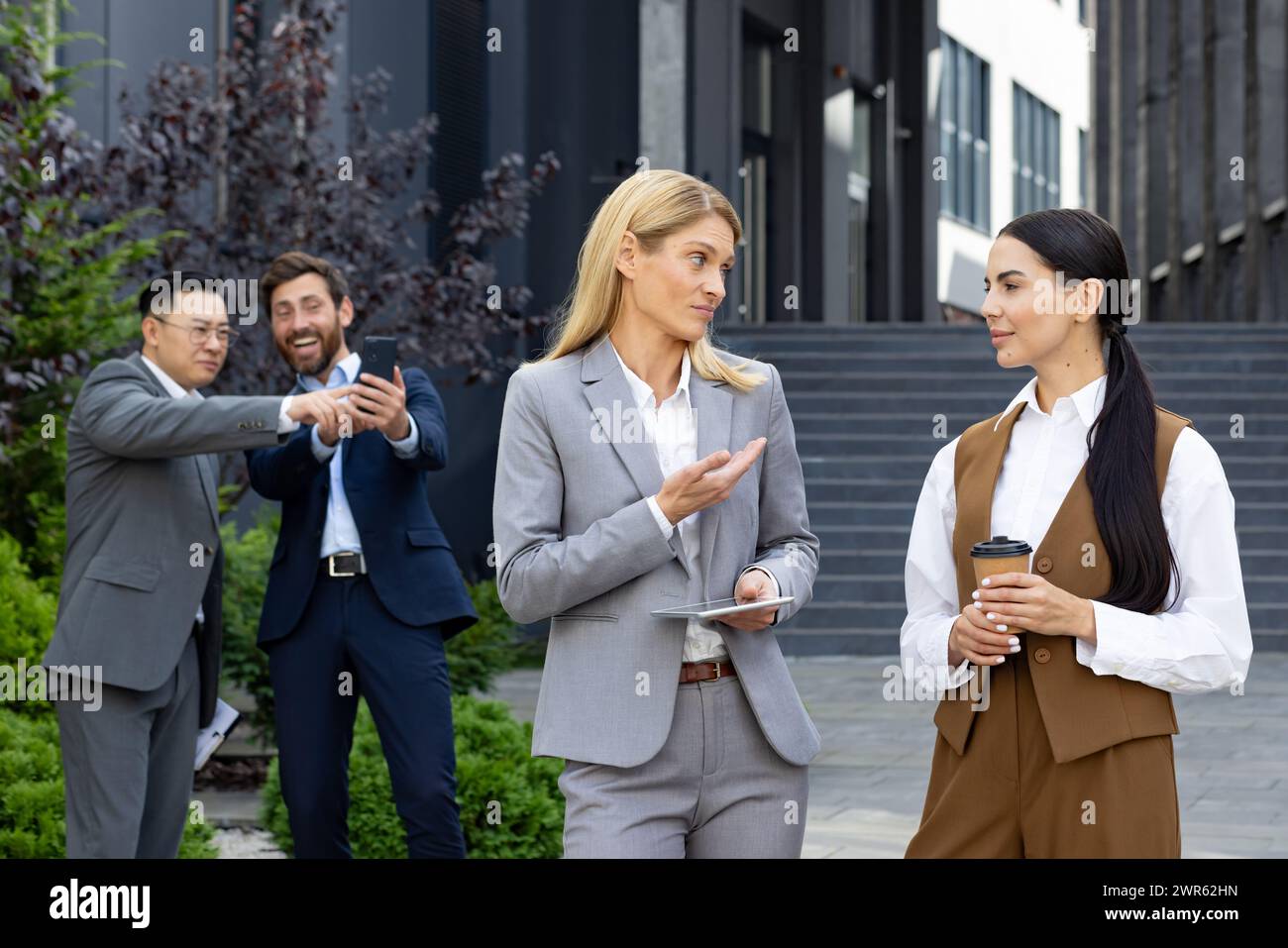 Bullying, sexism and ridicule in the team at work. Young women are ...