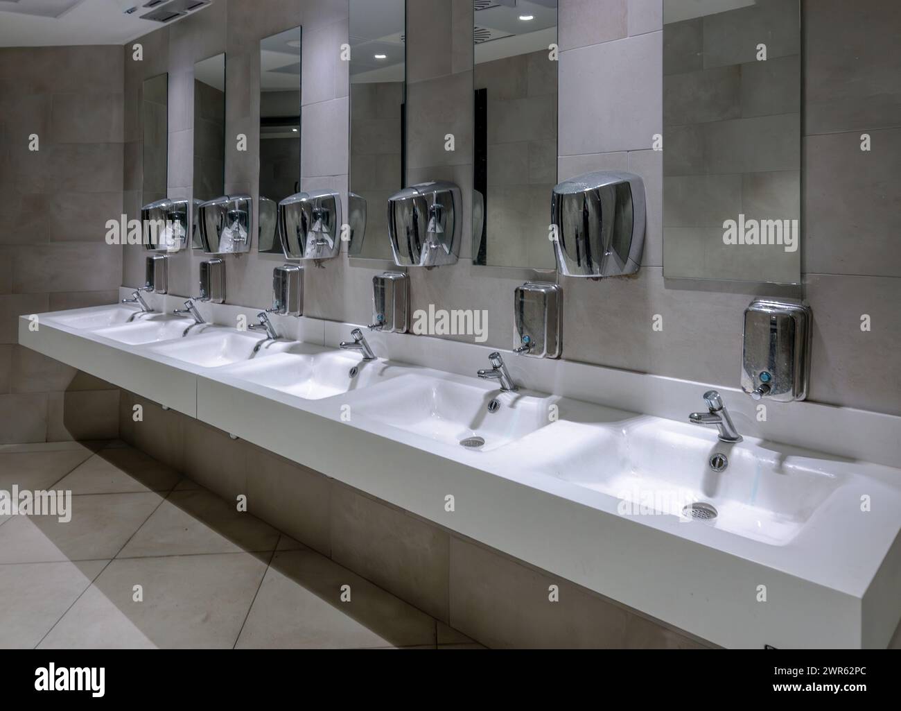 Washbasins with mirrors and soap dispensers in public toilet at truck stops on Italian highway Stock Photo Alamy
