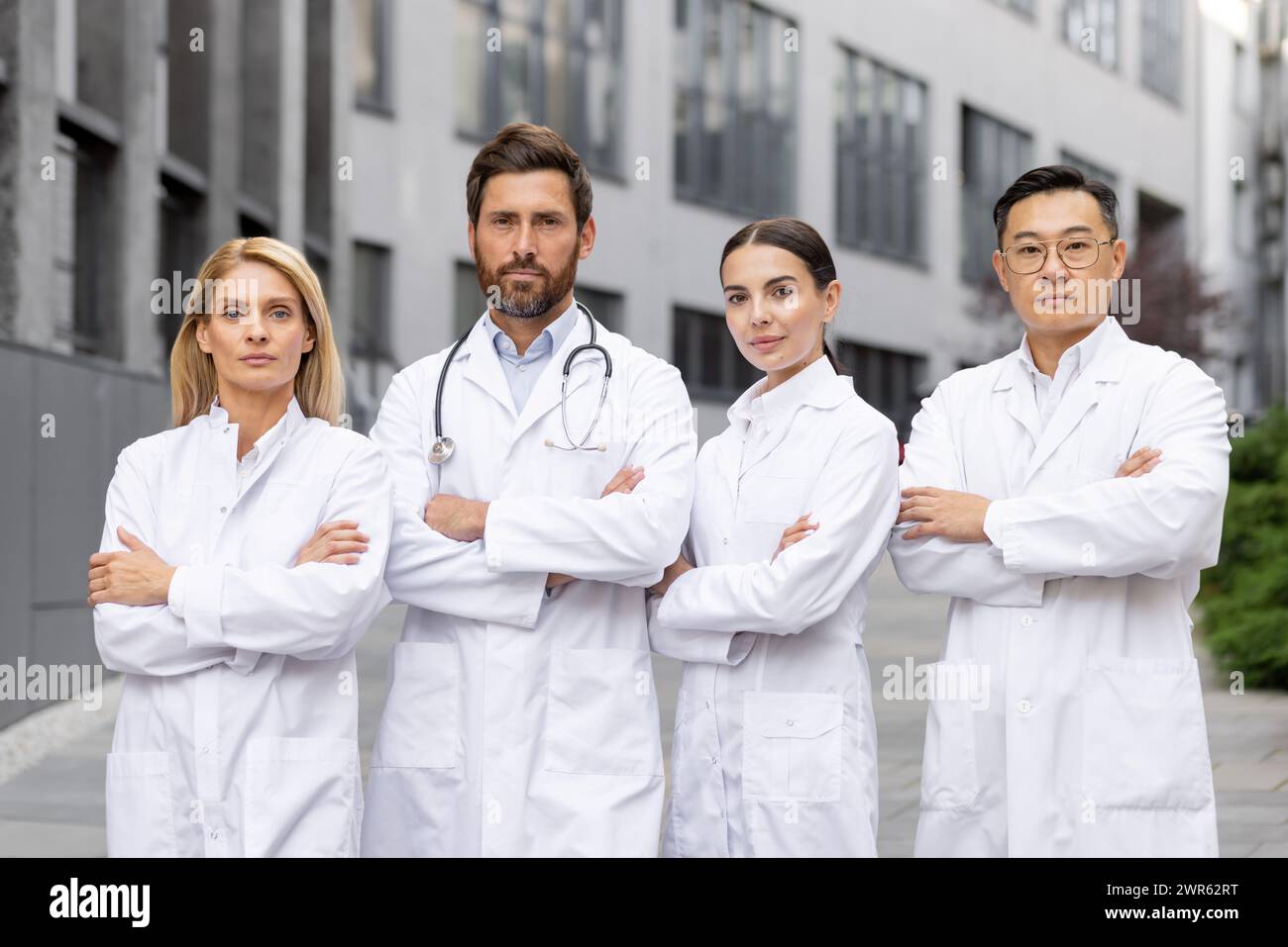 Group doctors standing together cross hi-res stock photography and ...