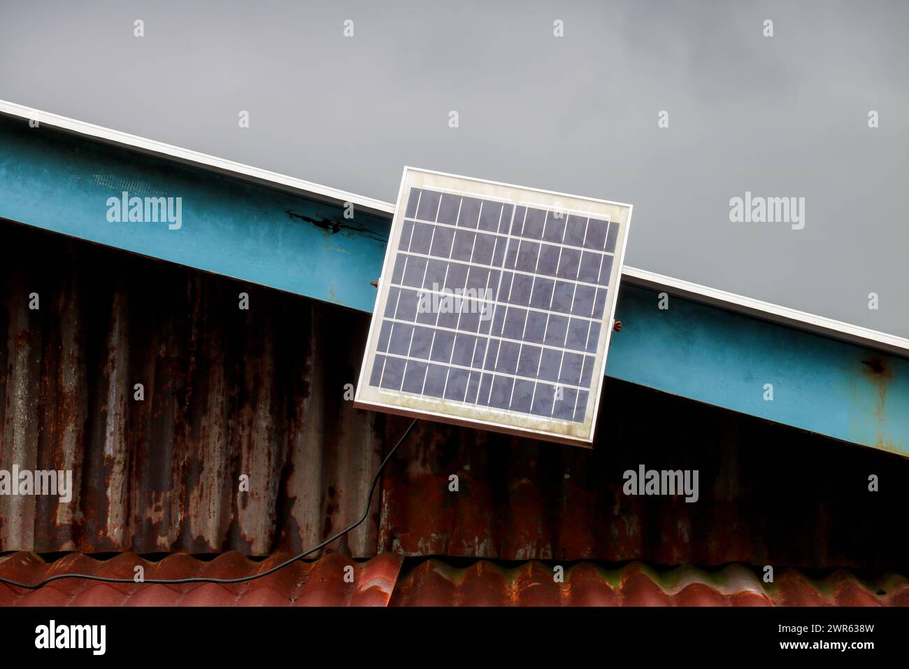 Old solar panel installed on the outside of a jungle village house in ...