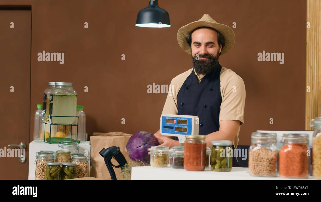 Local farmer vendor weighting produce at cash register counter, using ...