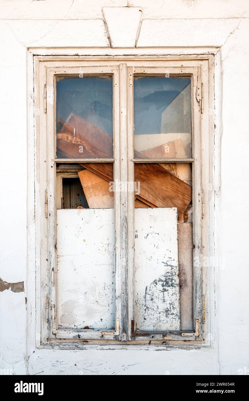 Old closed wooden window with broken glass, vertical image Stock Photo ...