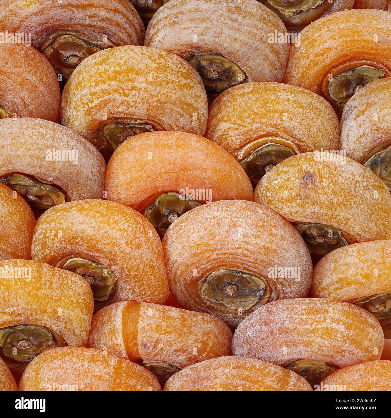dried persimmon on white background Stock Photo - Alamy