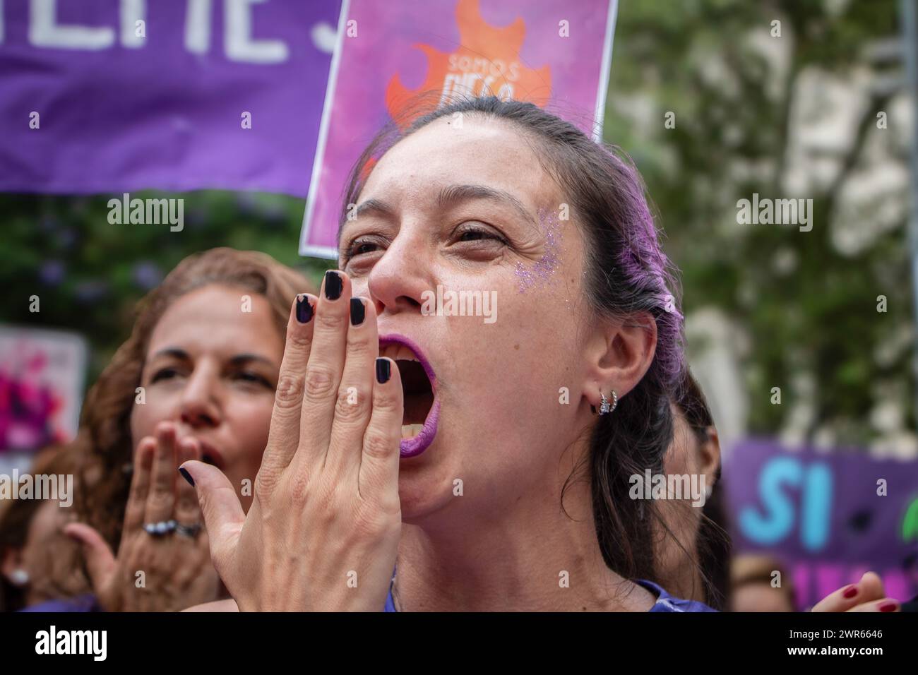 A young woman makes the zaghareet (Arab woman's cry), which has become ...