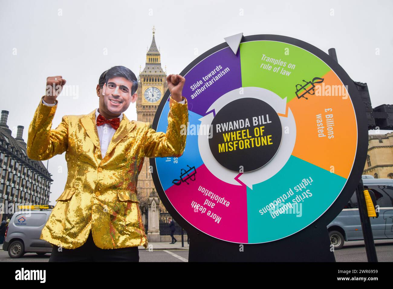 London, UK. 11th March 2024. An actor dressed as Rishi Sunak spins a ...