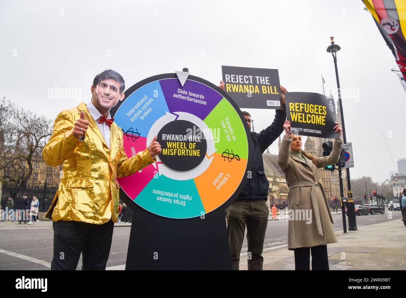 London, UK. 11th March 2024. An actor dressed as Rishi Sunak spins a ...