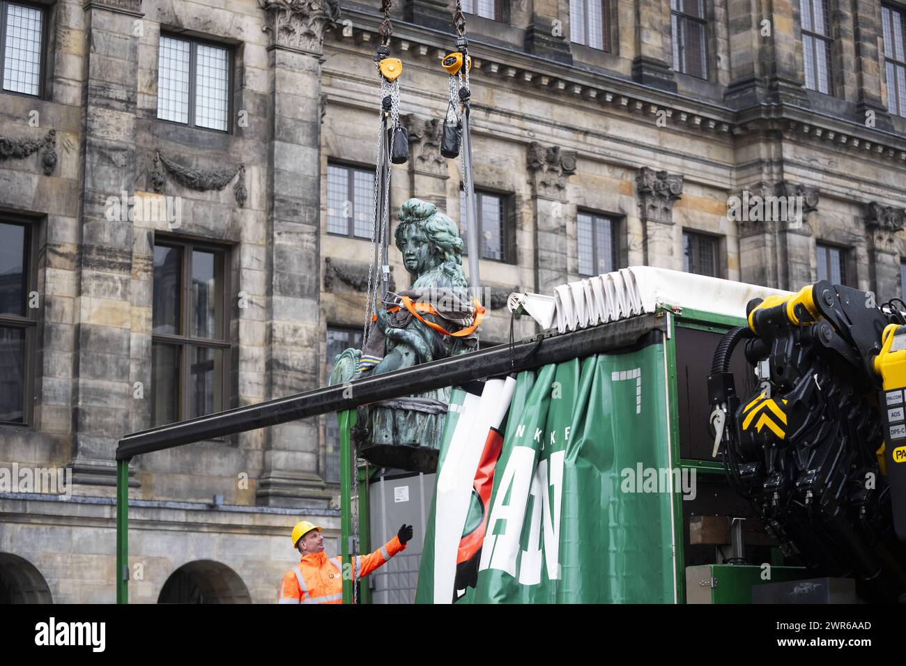AMSTERDAM - The bronze statue of Caution is removed from the roof of ...